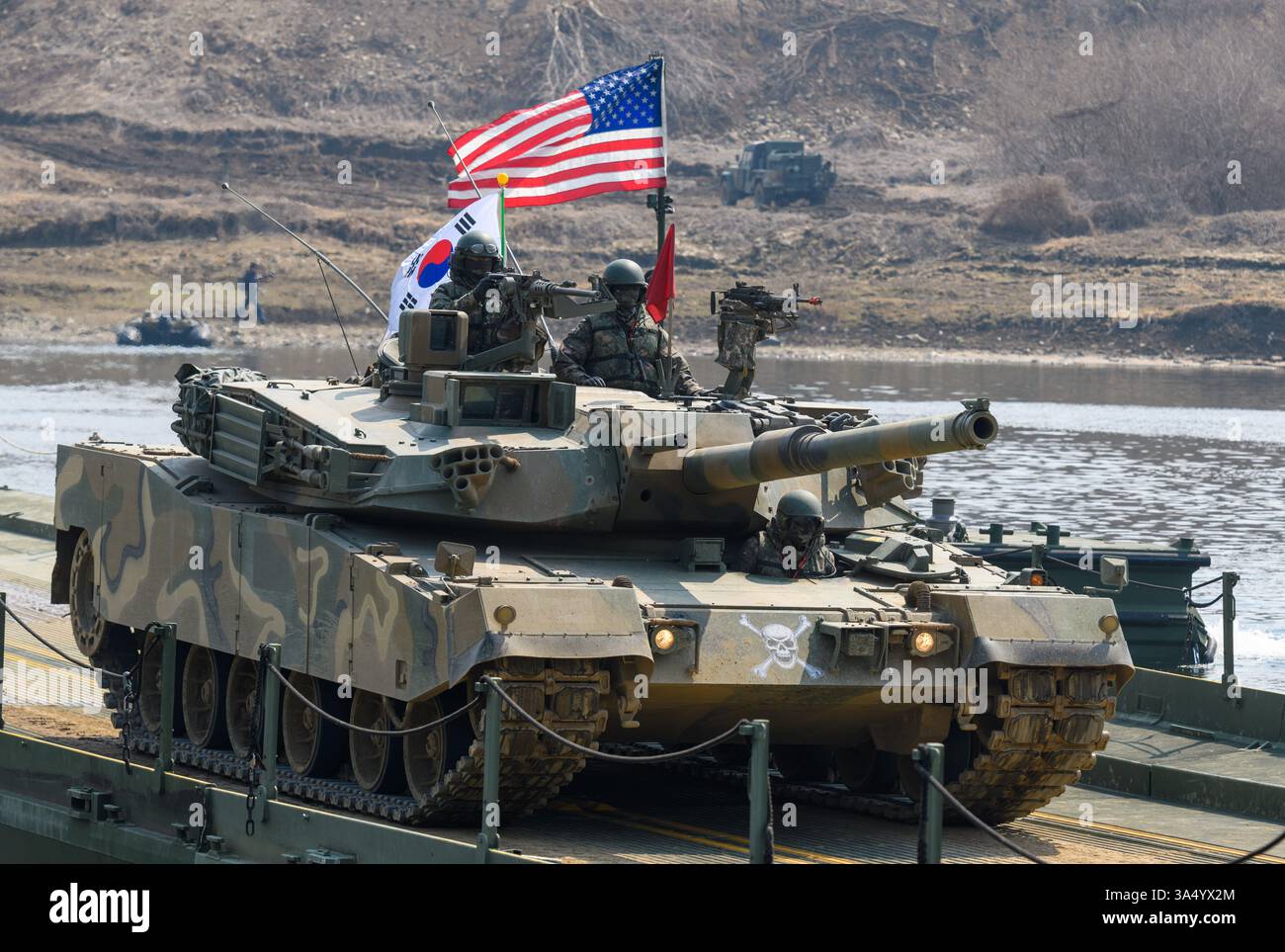 South Korean army K1E1 tank crosses a pontoon bridge on the Imjingang ...