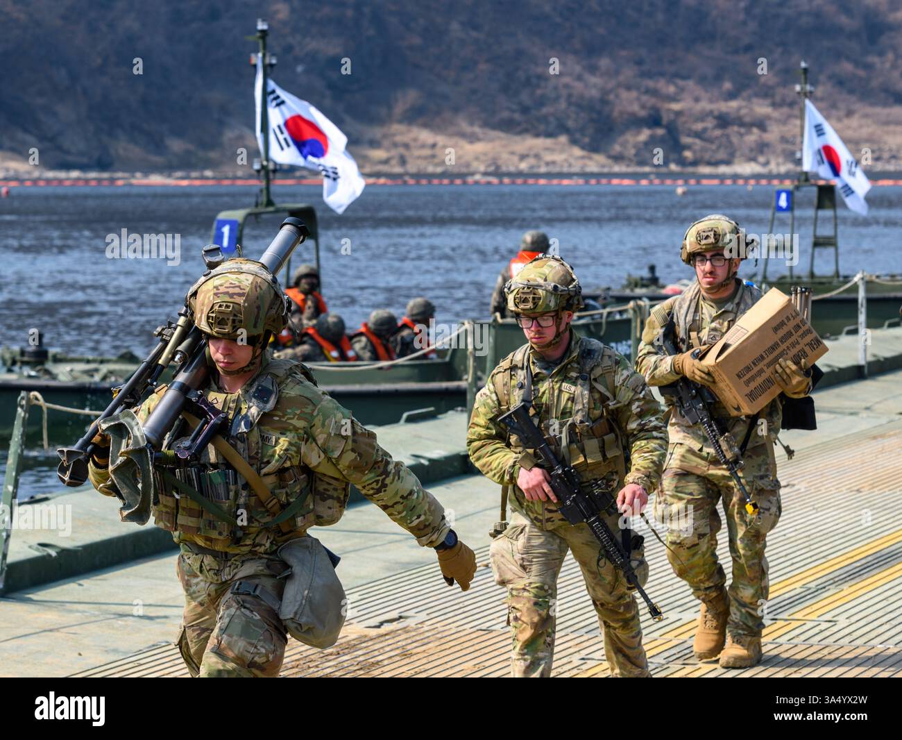Yeoncheon, South Korea. 20th Mar, 2025. U.S. Army soldiers cross a ...