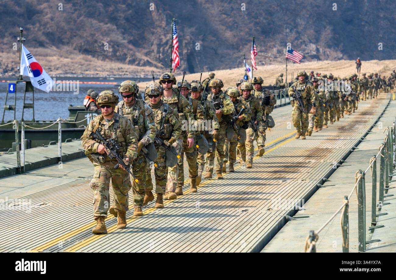 Yeoncheon, South Korea. 20th Mar, 2025. U.S. Army soldiers cross a ...