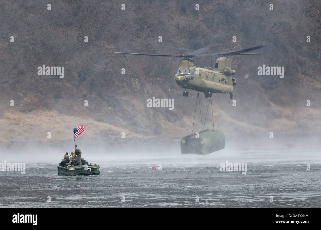 Yeoncheon, South Korea. 20th Mar, 2025. U.S. Army CH-47 Chinook helicopter carries an equipment ...