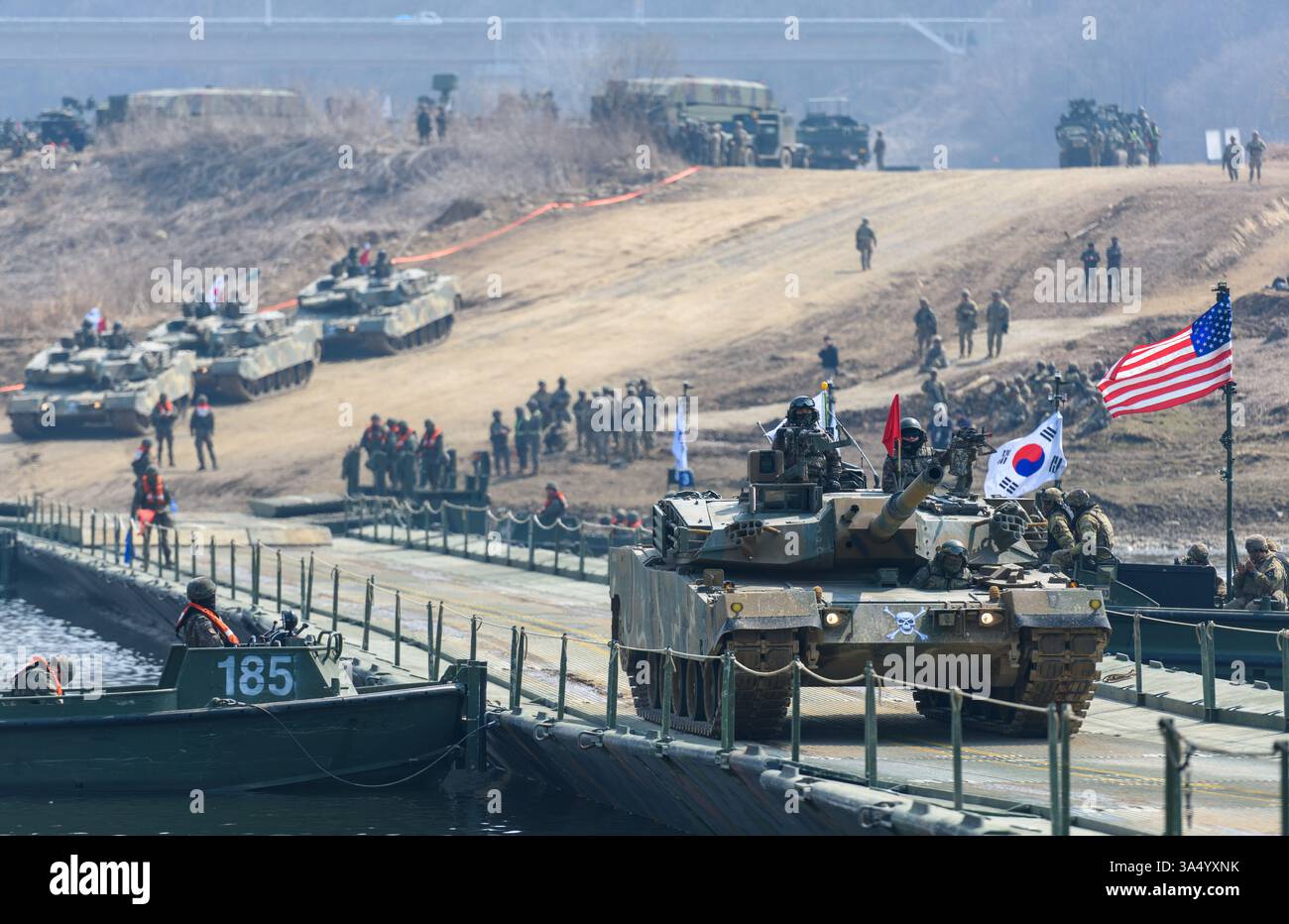 South Korean army K1E1 tank crosses a pontoon bridge on the Imjingang ...