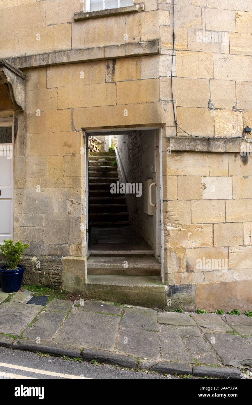 Narrow alleyway between two buildings with steps Stock Photo - Alamy
