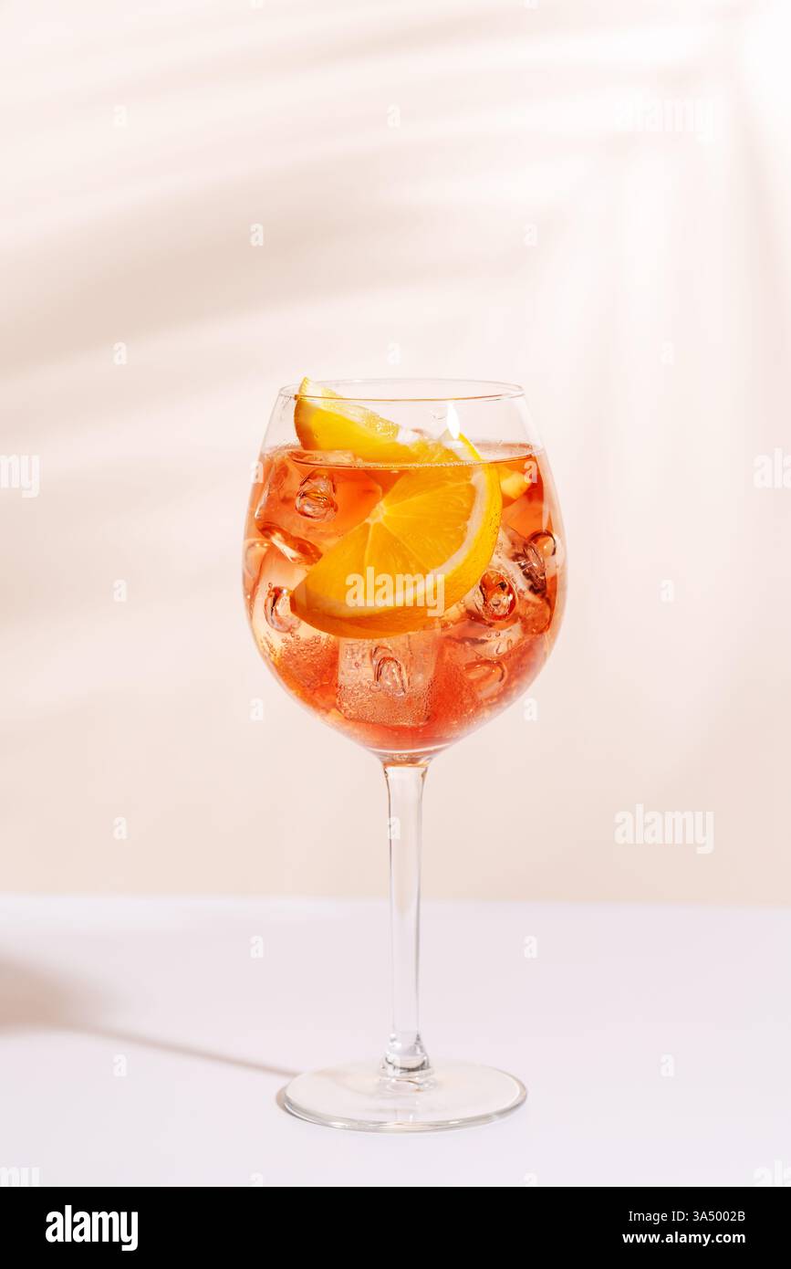 A vibrant display of cocktail Aperol Spritz against a bright background ...
