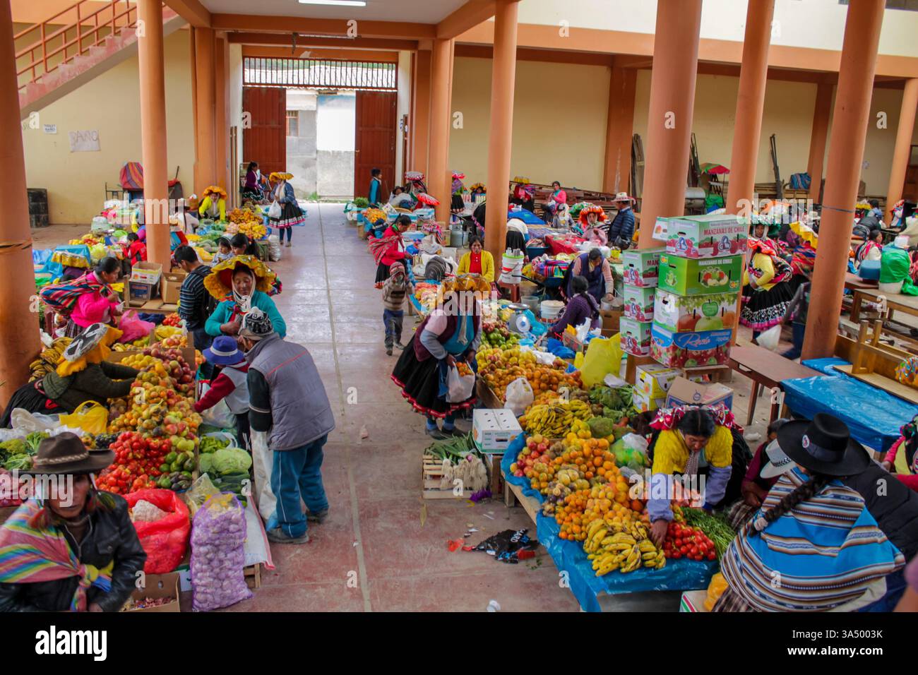 Women in traditional clothes and hats at the local market in Peru ...