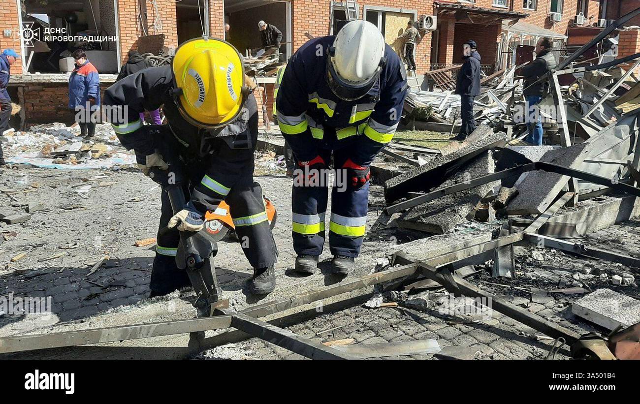 In this photo provided by the Ukrainian Emergency Service, searchers ...