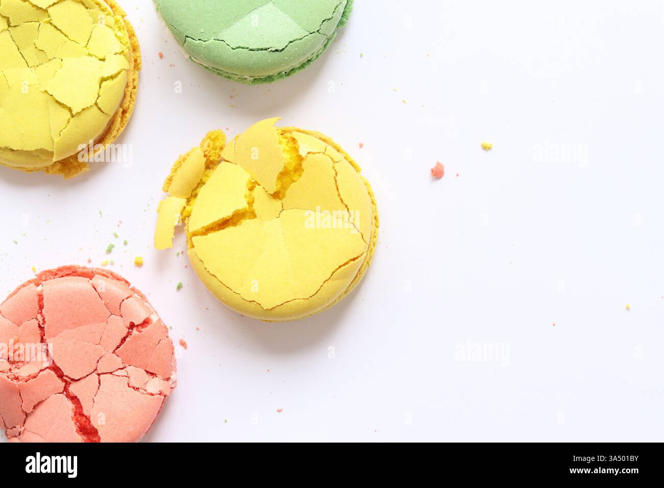 Bright multi-colored French macarons on a light background, top view ...