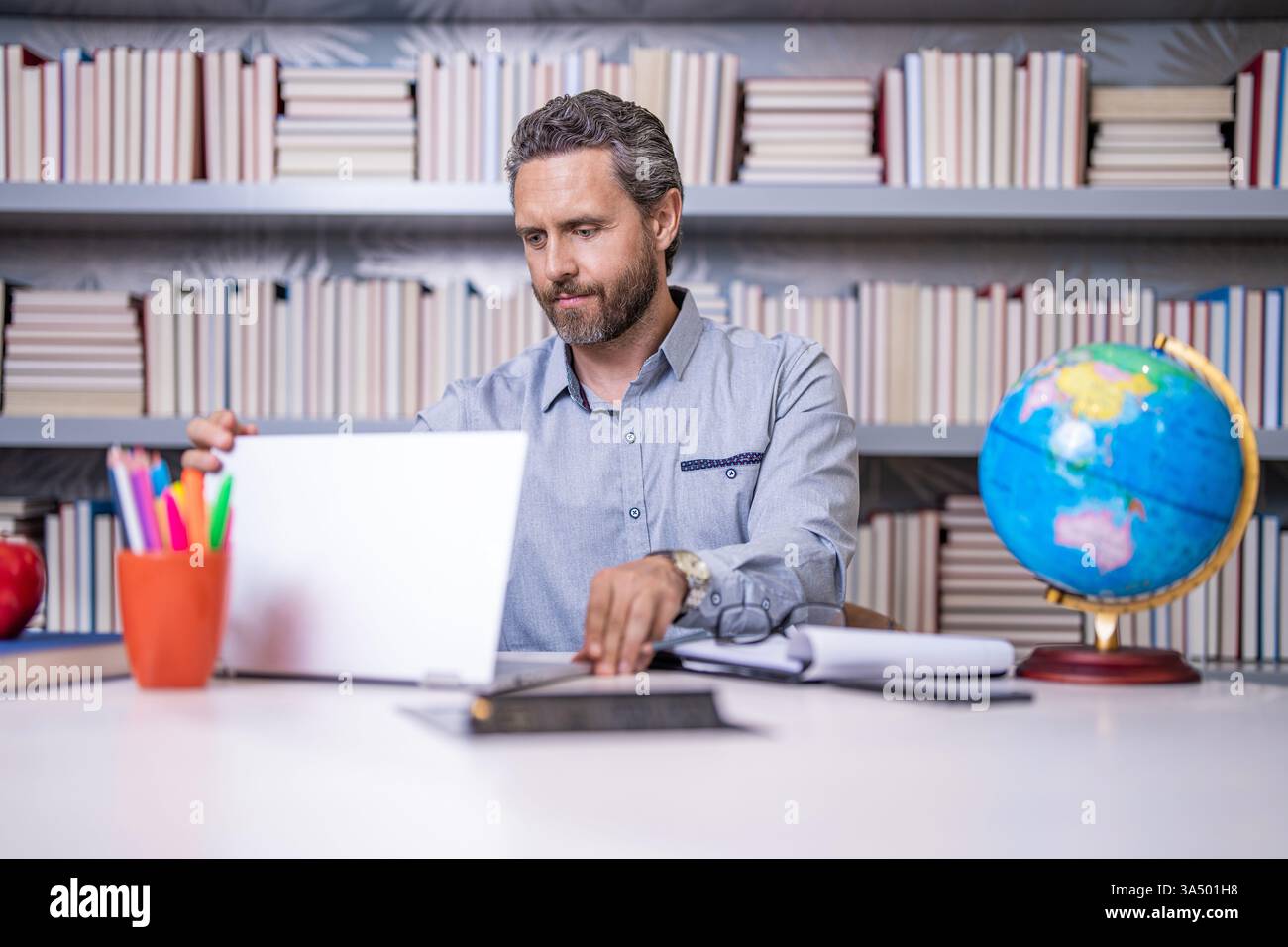 Millennial school teacher geography. Man teaching geography lesson ...