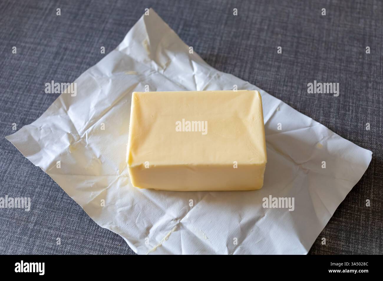Unwrapped British unsalted butter block Stock Photo - Alamy