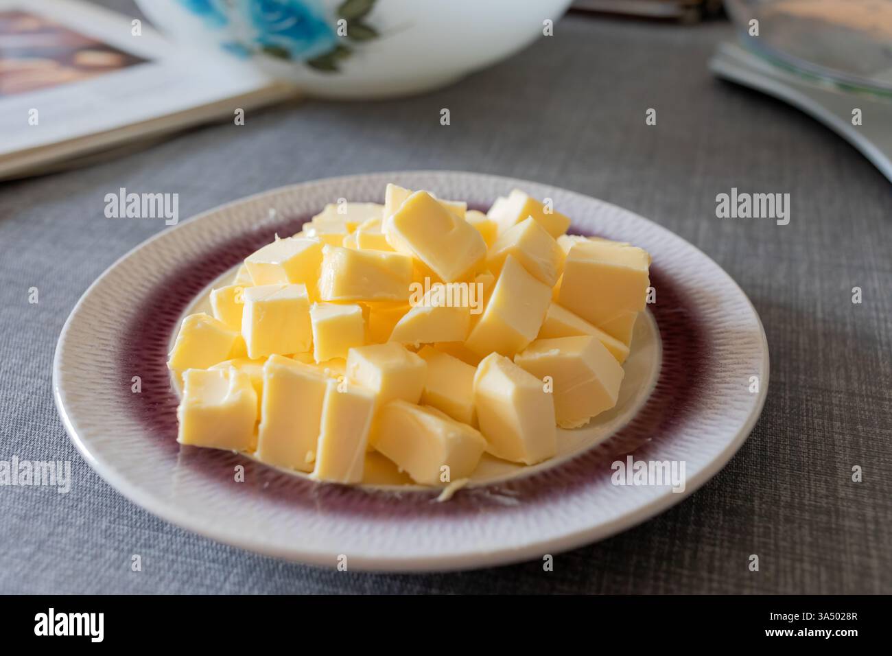 Chopped cubes of butter on a plate Stock Photo - Alamy