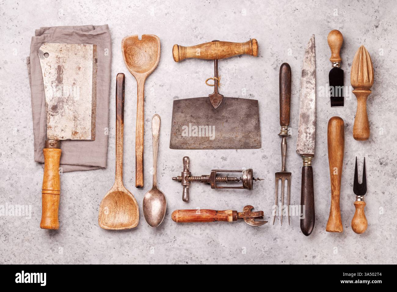 A collection of various retro kitchen and cooking utensils displayed on ...