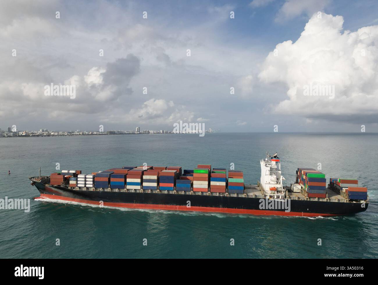 Commercial shipping. Cargo ship in sea, aerial view. Freight container ...