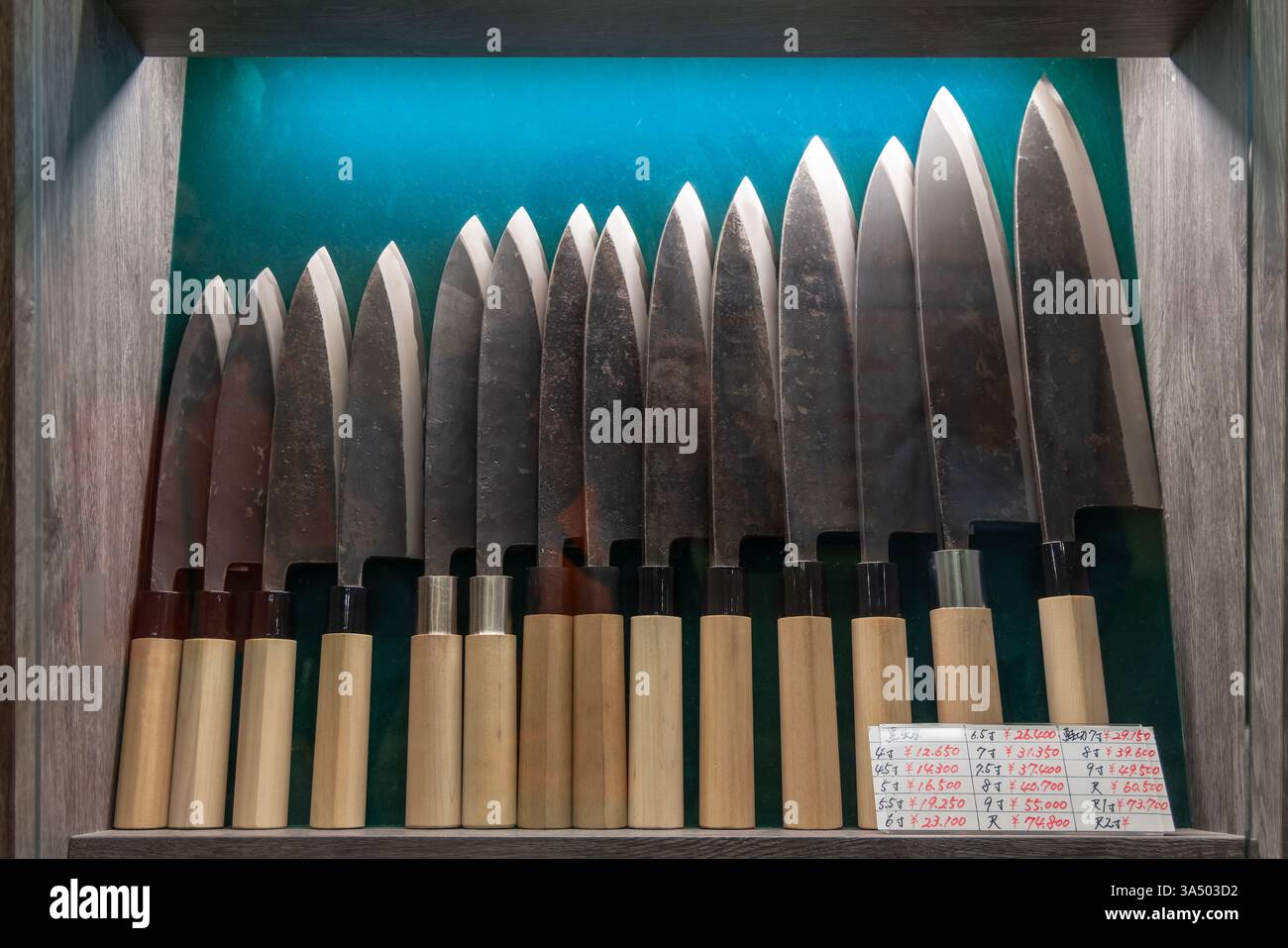 Traditional Japanese knives with wooden grips and sharp steel blades ...