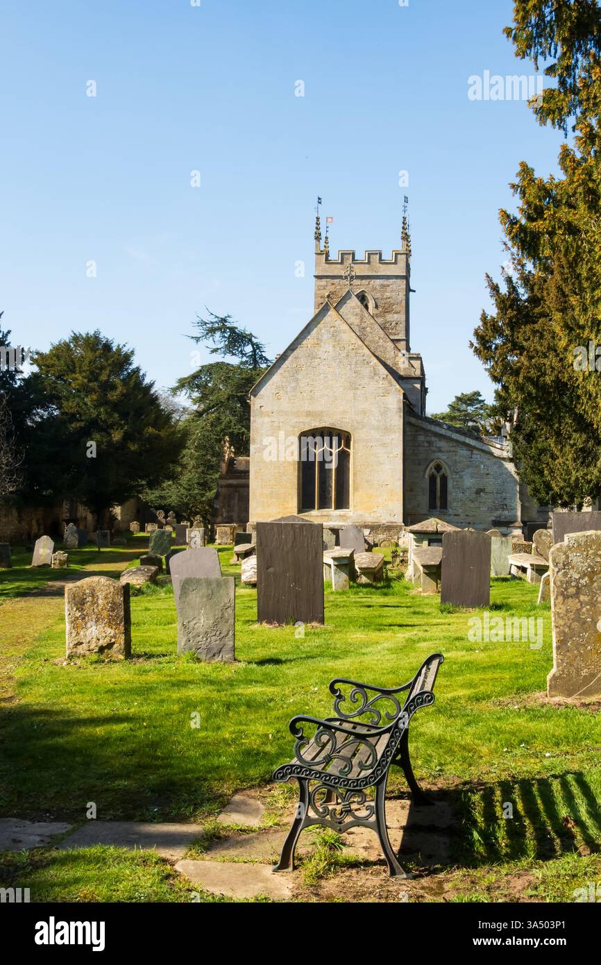 An empty seat in the graveyard of St Peter and St Pauls village church ...