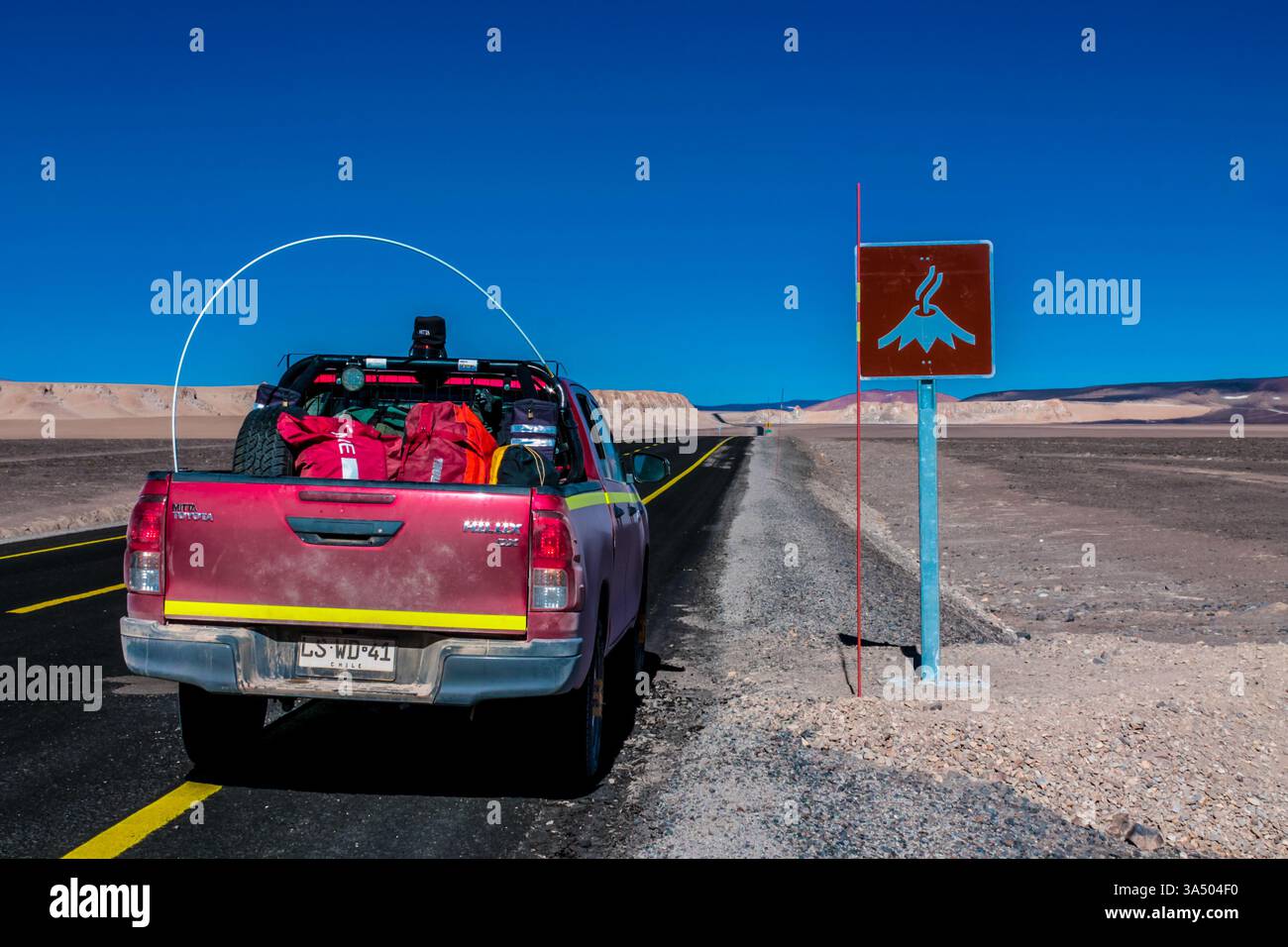 Red off road cars vehicle in Atacama desert in Chile. Long and hard ...