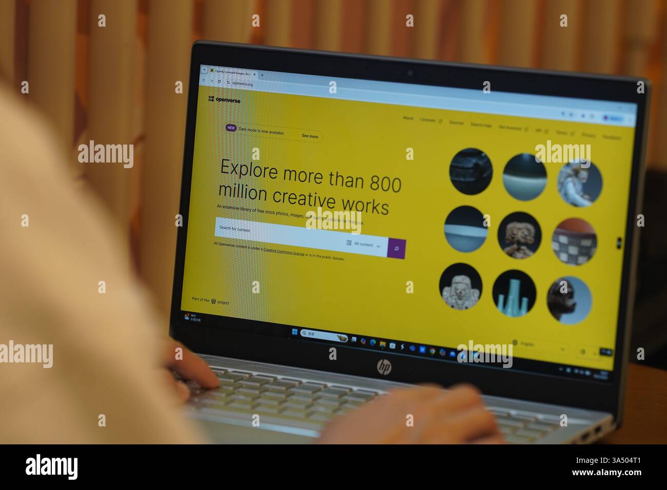 China. 19th Mar, 2025. In this photo illustration, A woman browses Openverse website on her ...