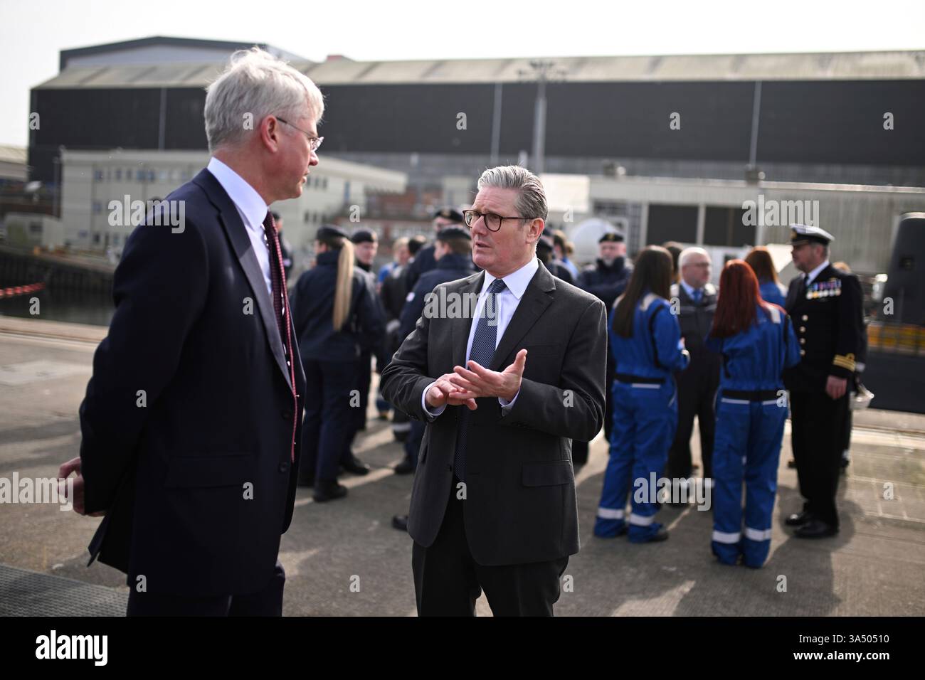 Britain's Prime Minister Keir Starmer, right, speaks with the CEO of ...