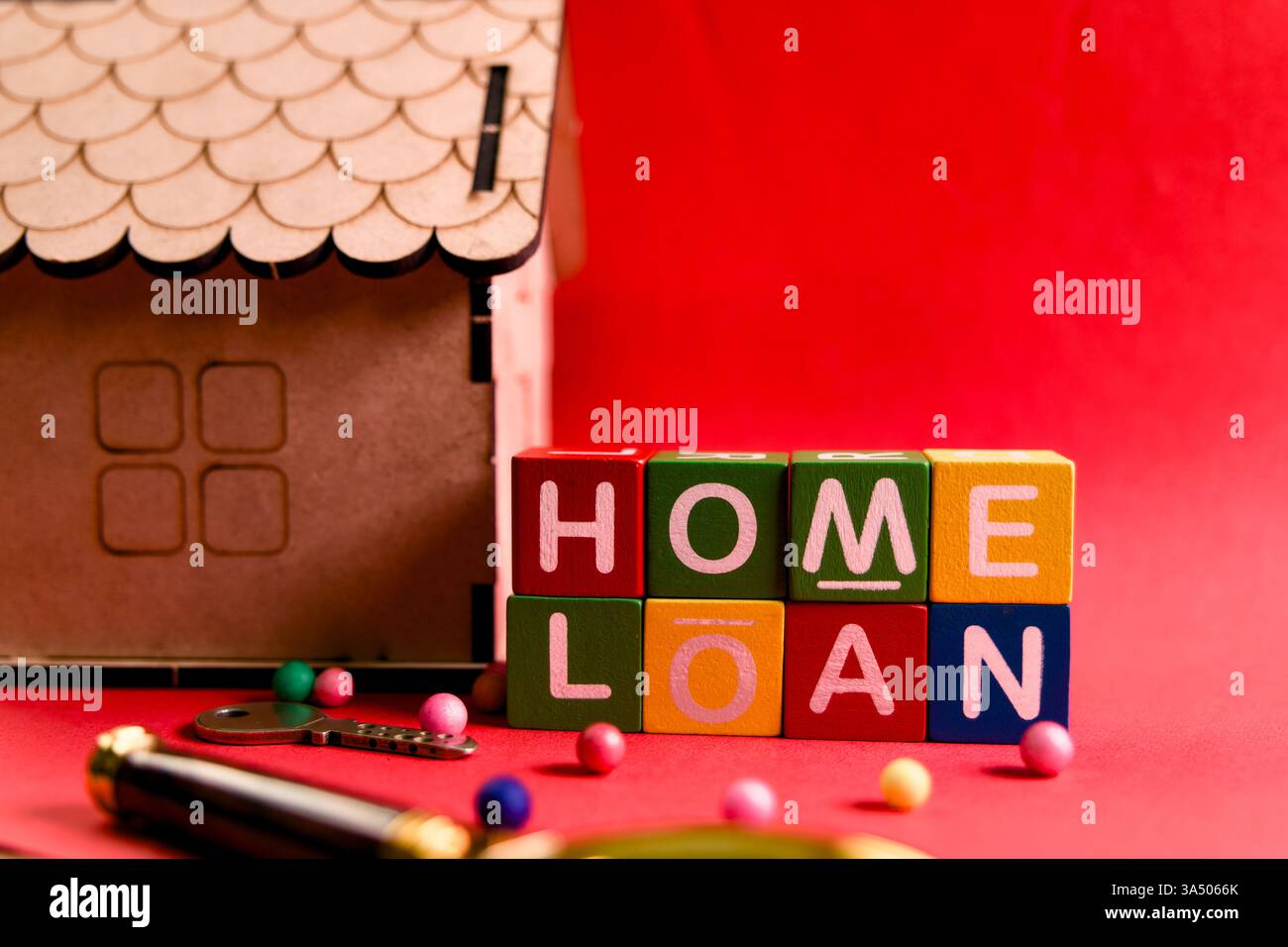Colorful building blocks arranged to form the words home loan beside a ...