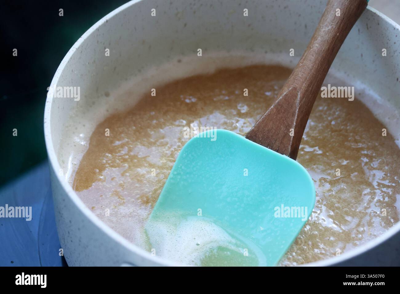 Woman stirs boiling syrup hi-res stock photography and images - Alamy