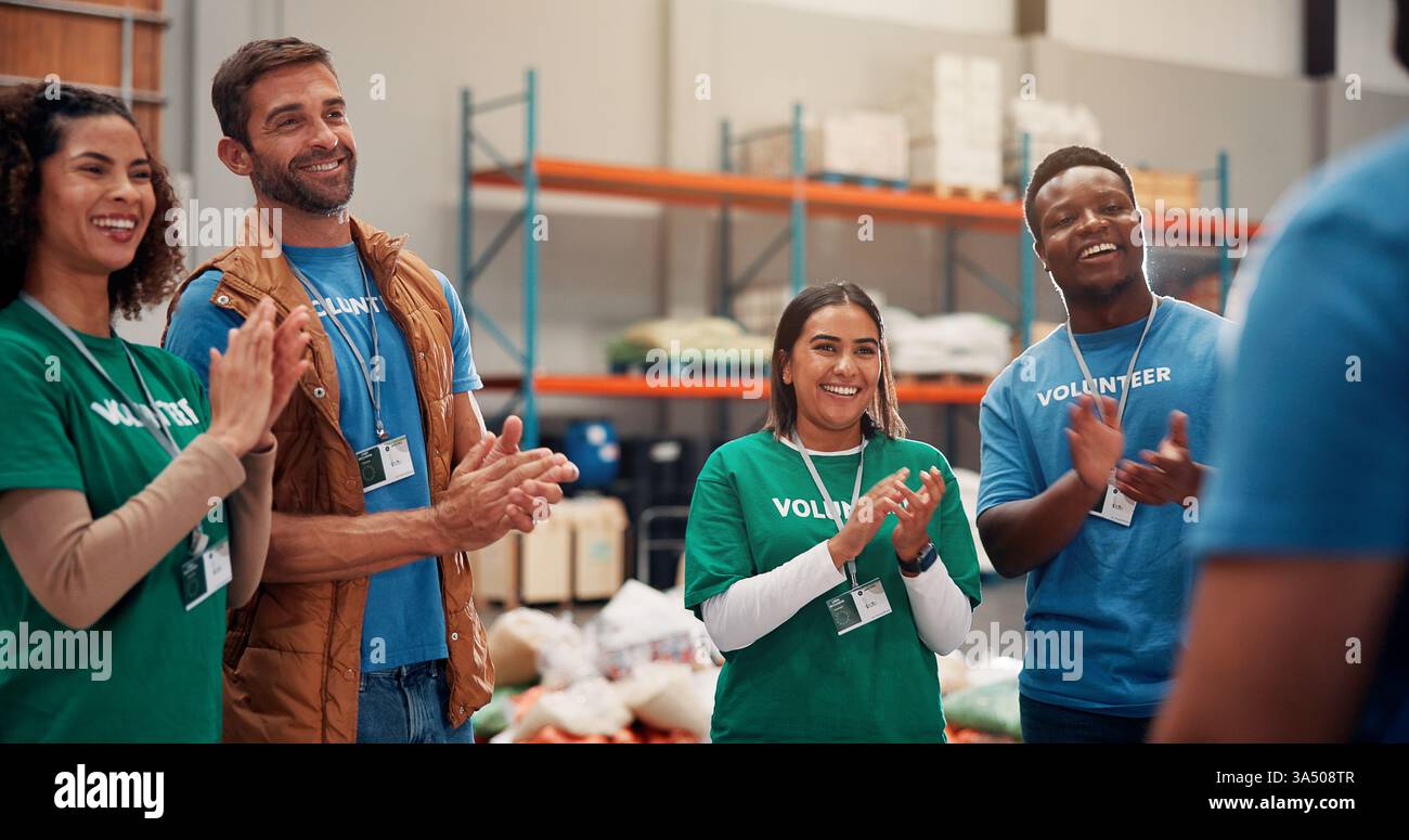 Volunteer group, teamwork and celebration with applause in warehouse ...