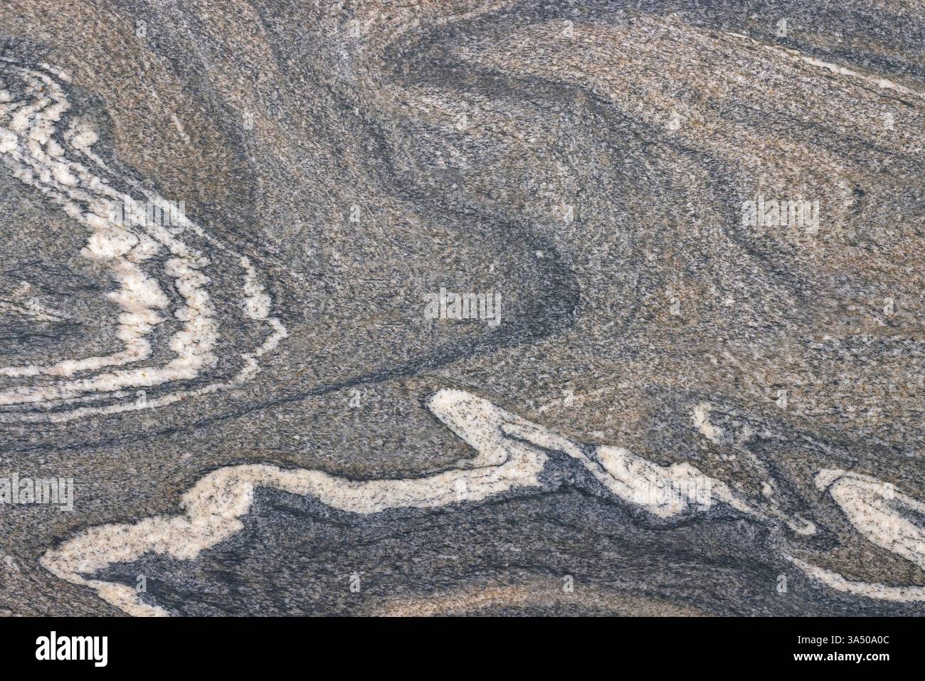 Intricate patterns emerge from a surface resembling natural stone ...