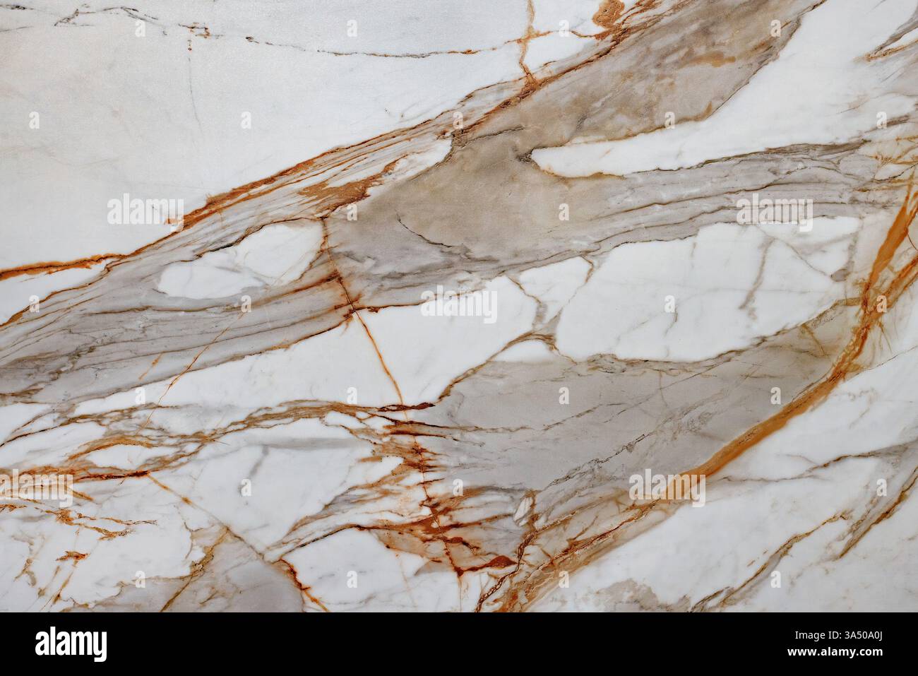 This stunning marble surface showcases swirling veins of gold and gray ...