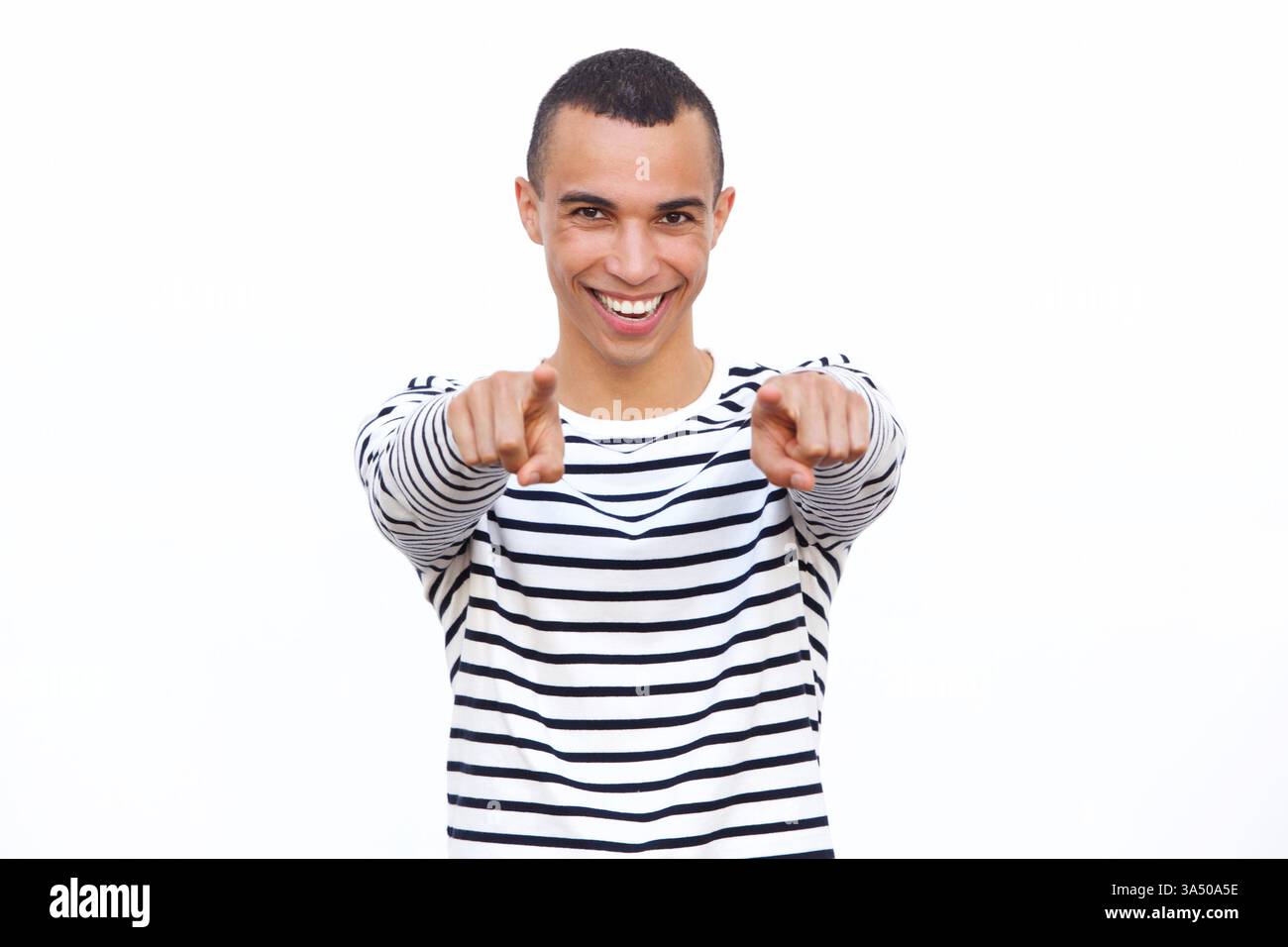 Portrait of happy young man pointing fingers Stock Photo - Alamy