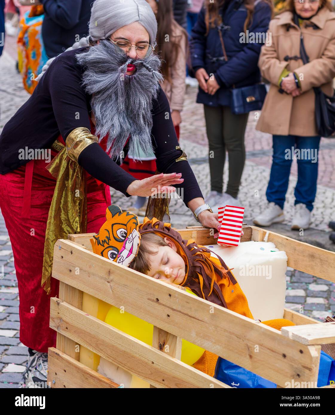 Sleeping child in a cart at Carnival in Tomar, Portugal 2025 Stock ...