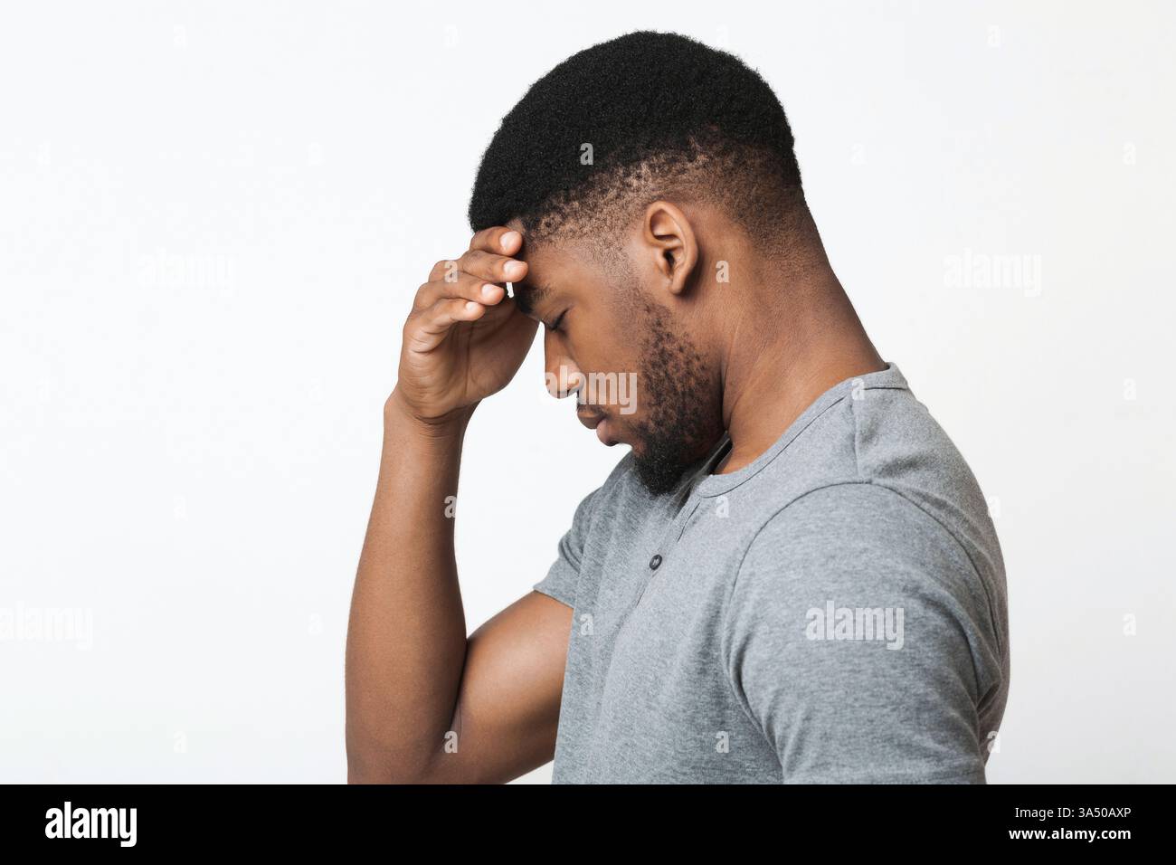 Lack of inspiration. Depressed african-american man deep in thoughts ...