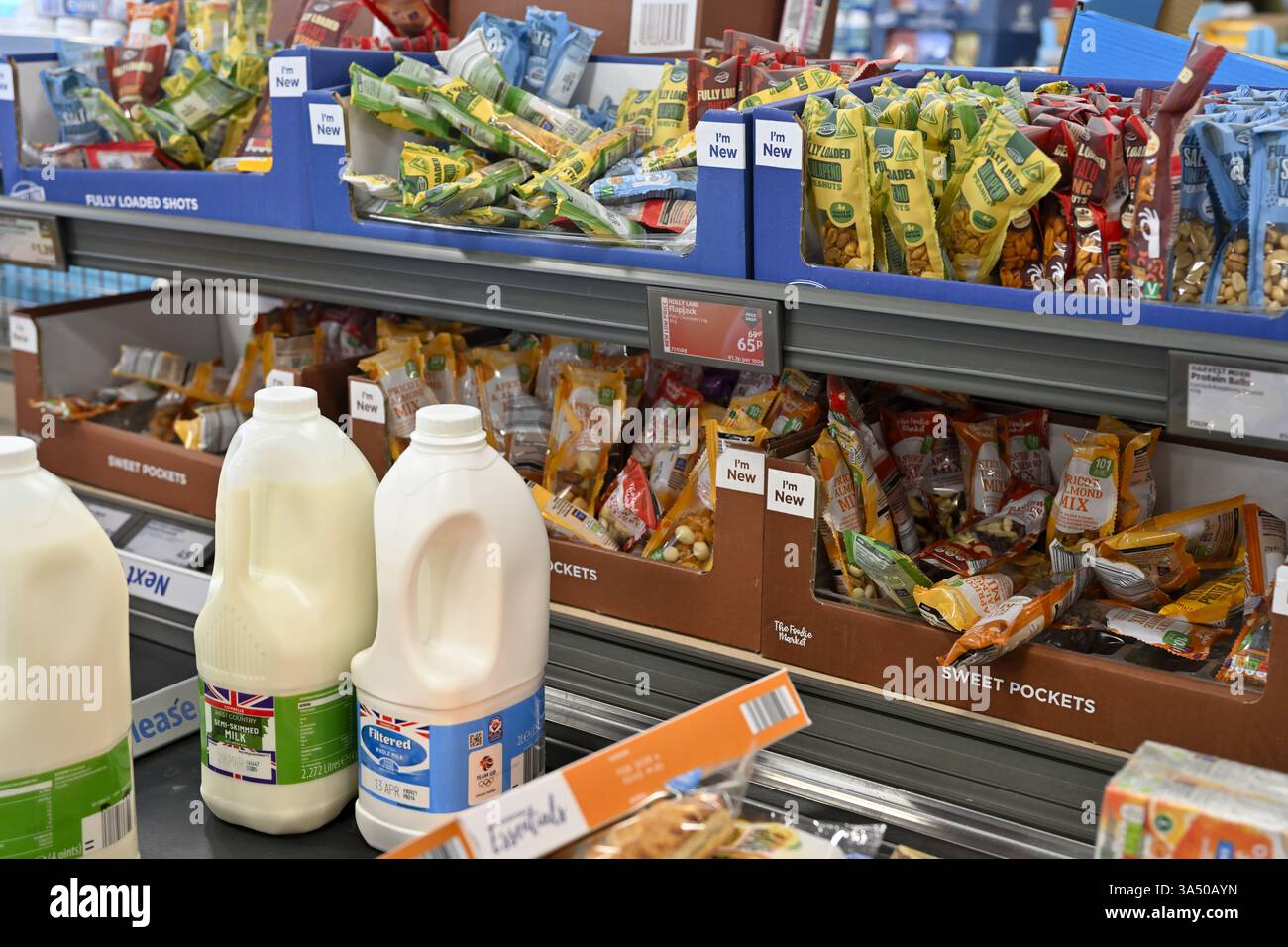 Sweets display at checkout counter conveyor belt in Aldi supermarket ...