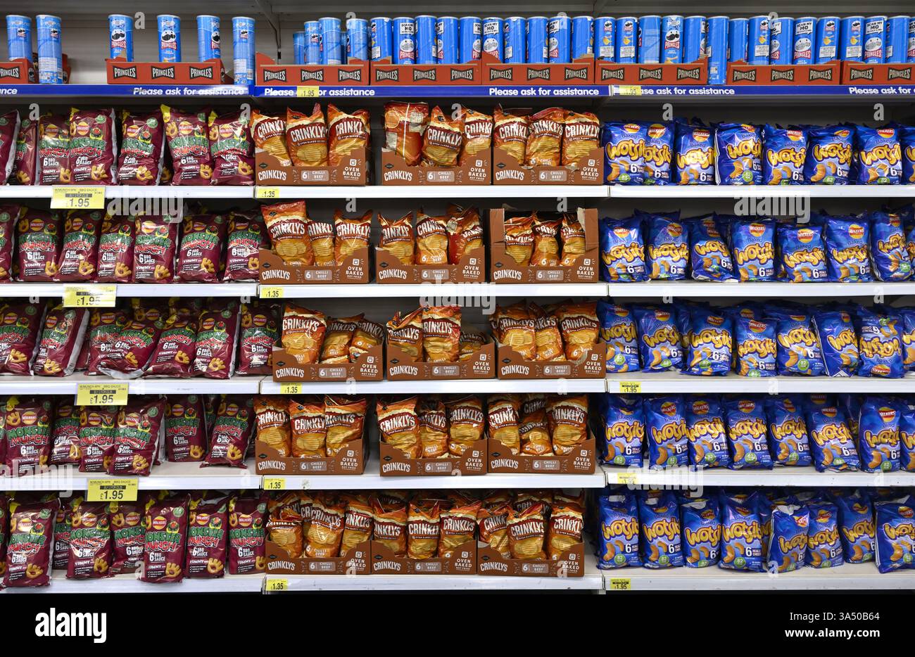 Bags of crisps, potato chips, on shelves in store, Monster Munch ...