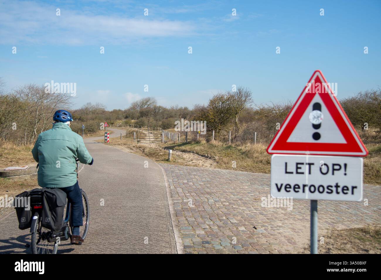 warning sign for cattle grid at cycle path through dunes in Meyendel ...