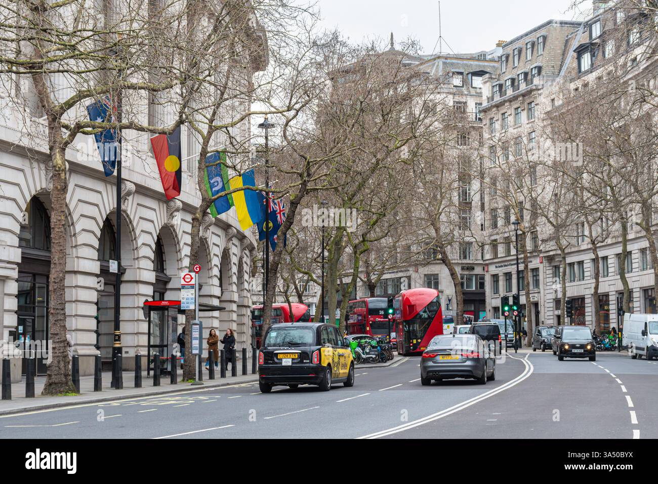 Aldwych London street view with traffic and pedestrians passing ...
