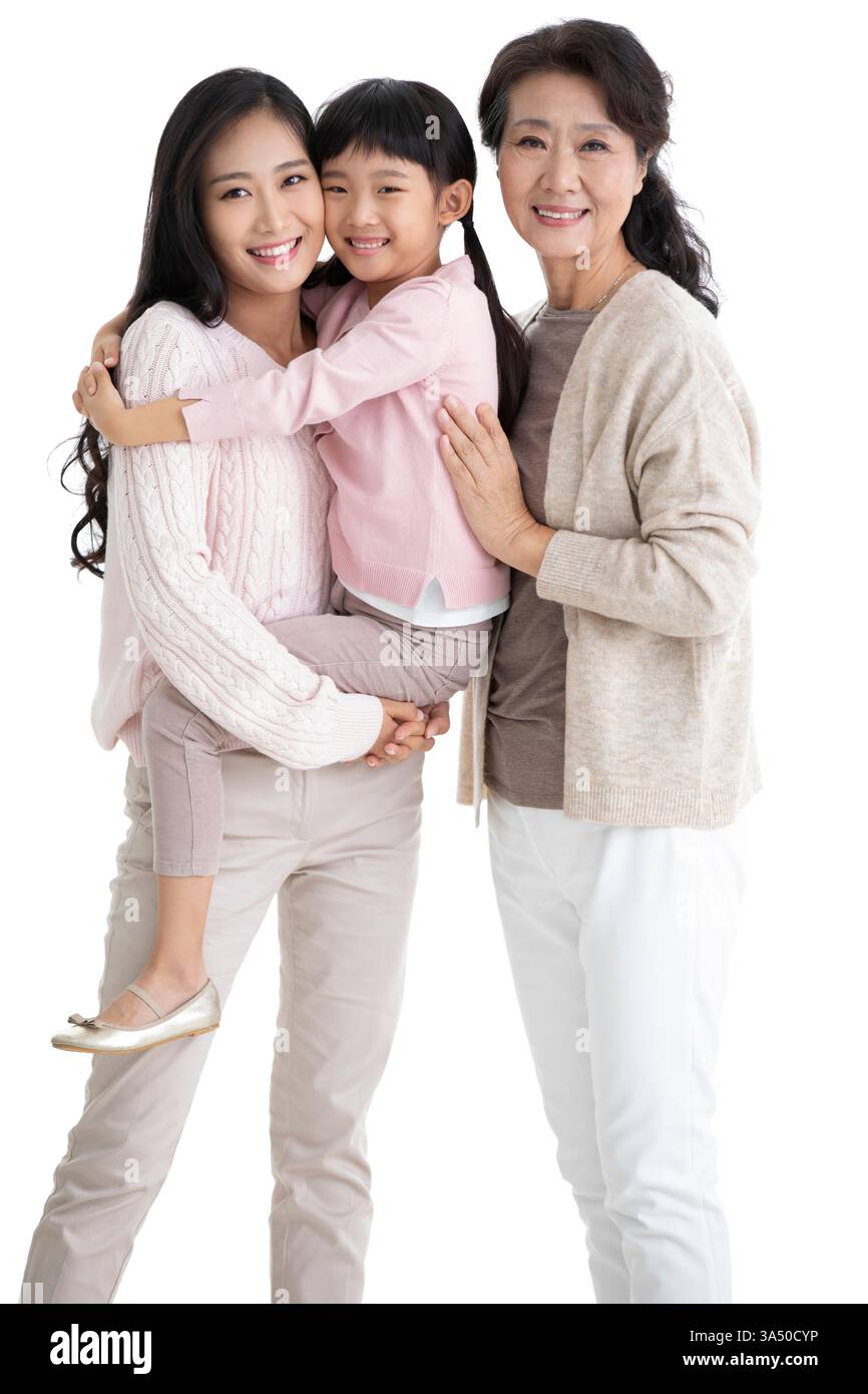 Smiling Chinese mother and grandmother carrying Chinese daughter while ...