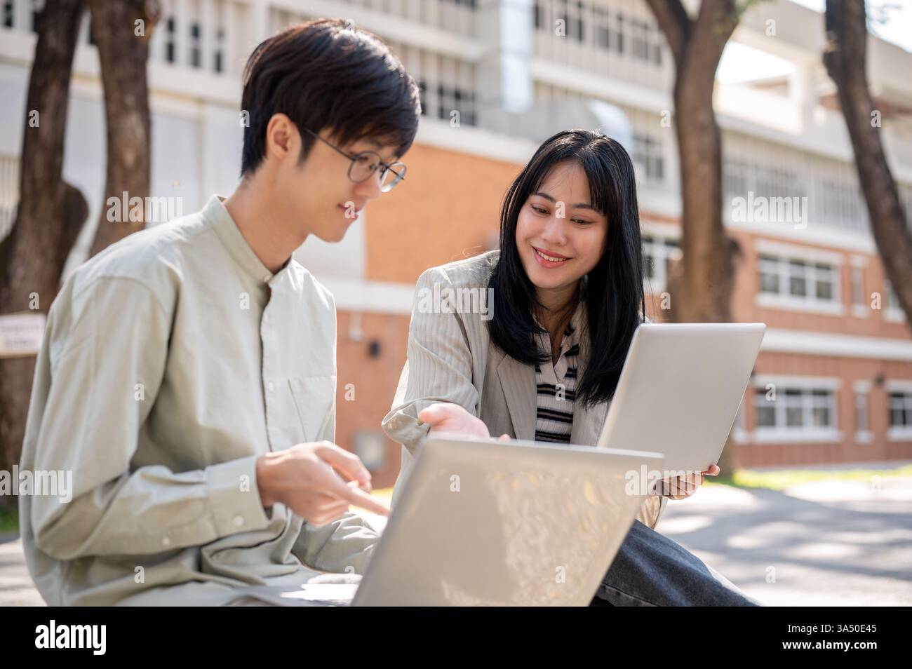 A friendly, beautiful Asian female university student is discussing ...