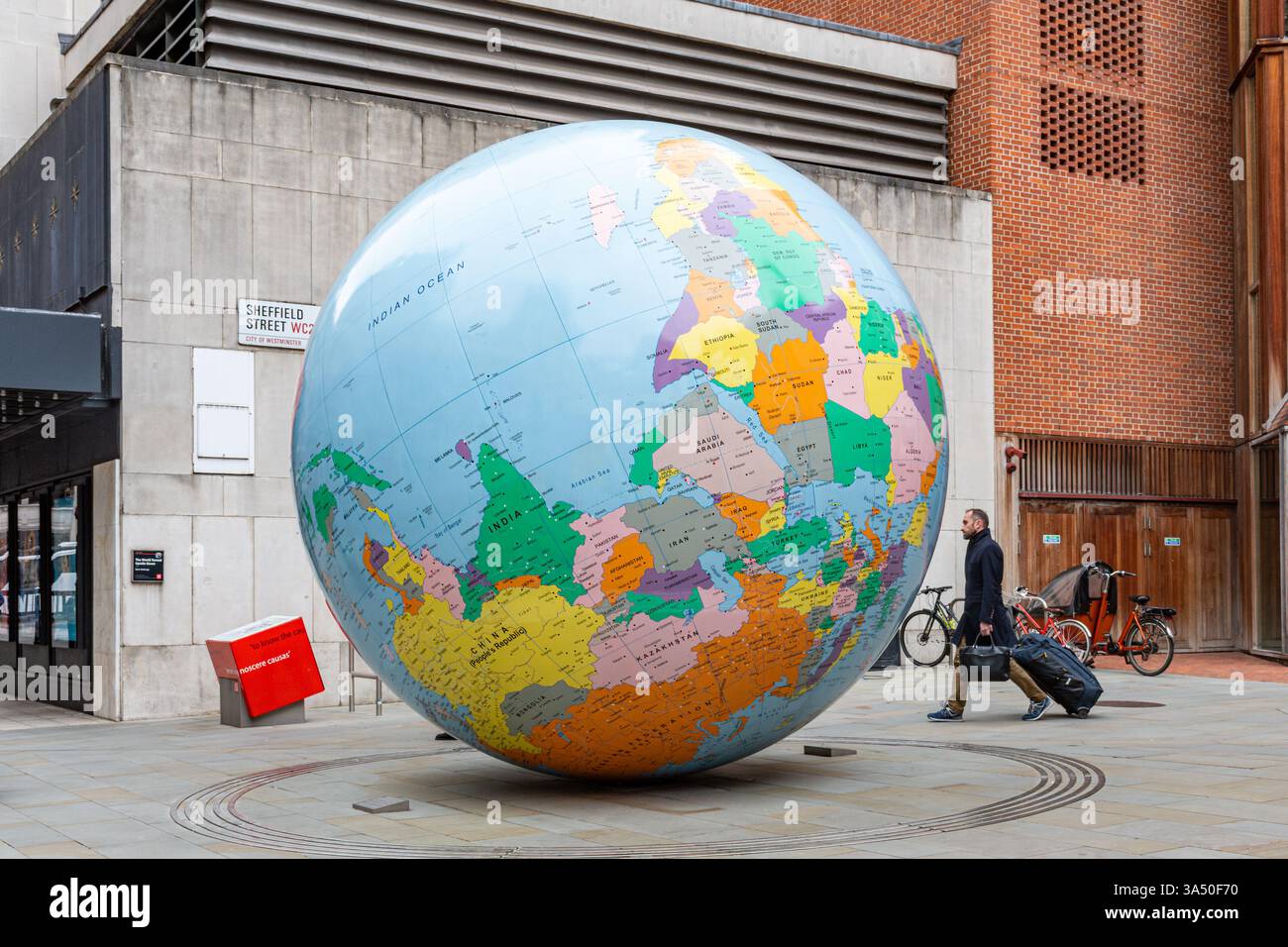 Globe art installation at LSE, The World Turned Upside Down by the ...