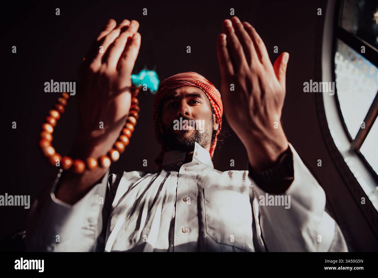Muslim Arabic man praying. Religious muslim man praying inside the ...