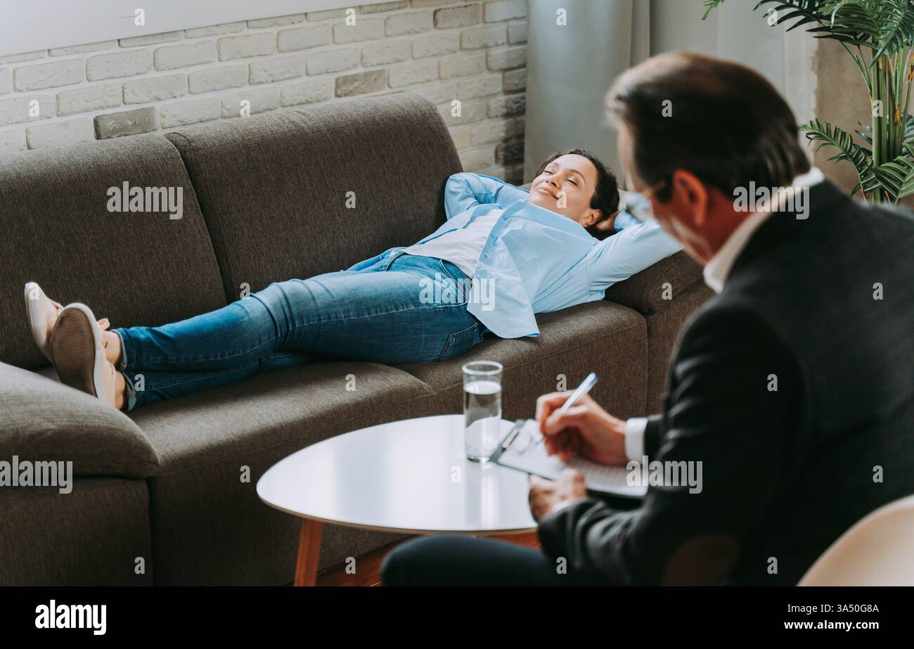 Portrait of a psychologist in a therapy session with a patient in a ...