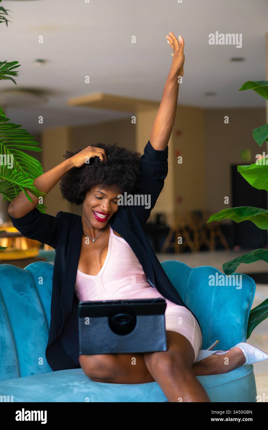 Young entrepreneur of black race and afro hair making a video call very ...