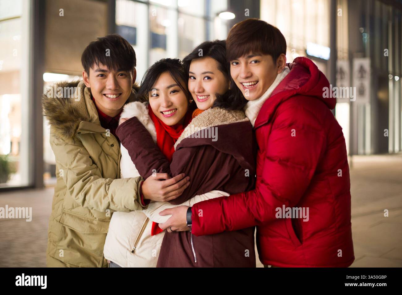 Happy young Chinese friends Stock Photo - Alamy