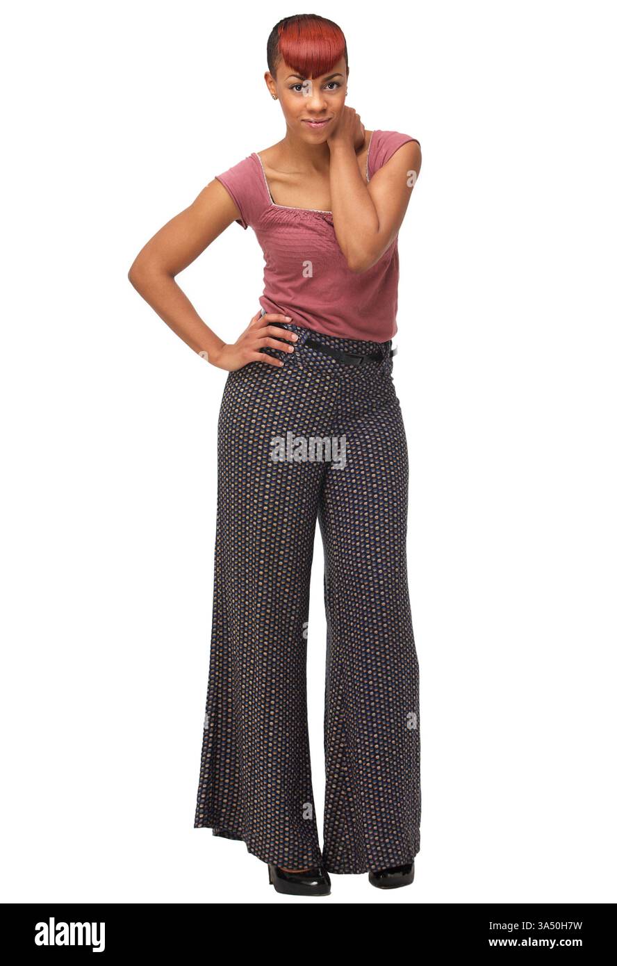 African American woman with hand on neck and hand on waist standing ...