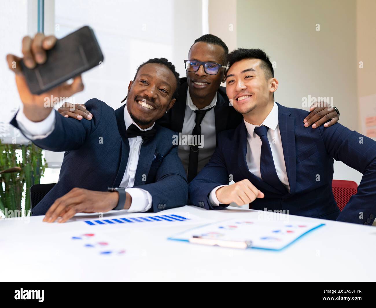 Group of smiling, multiracial business colleagues in formal suits ...