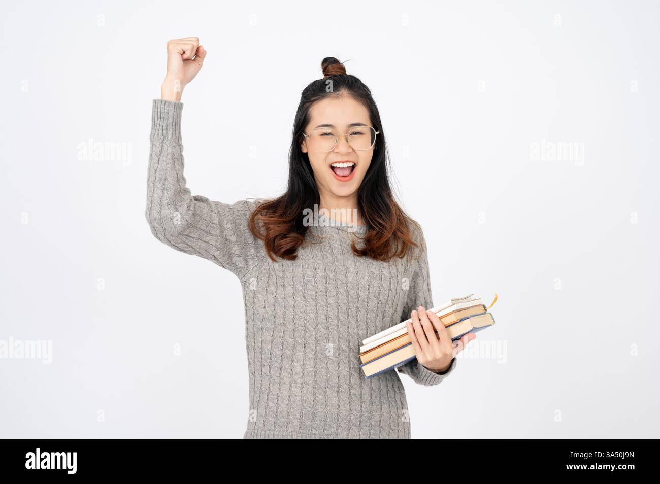 Adorable and cheerful Asian college student showing happy pose ...