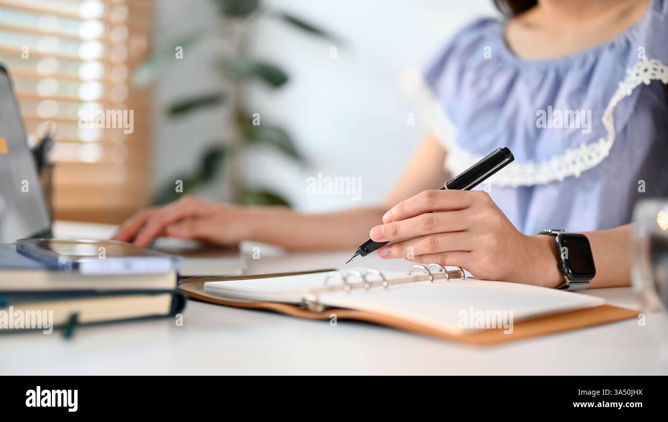 Women hand pen checking notes hi-res stock photography and images - Alamy