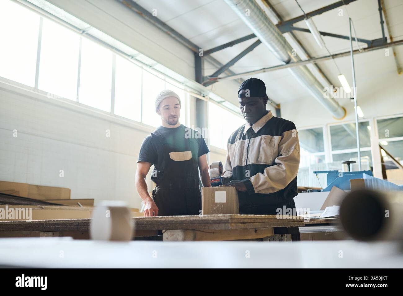 African american men packing products hi-res stock photography and ...
