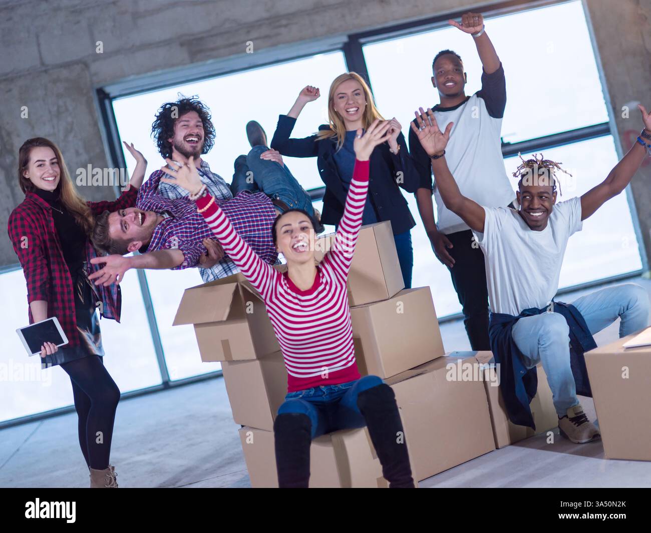 Cheerful diverse group of business people raising arms celebrating ...