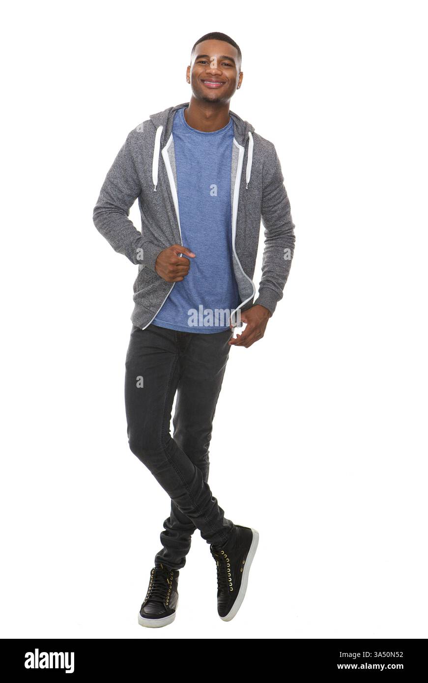 Smiling African American man holding on jacket standing with crossed ...