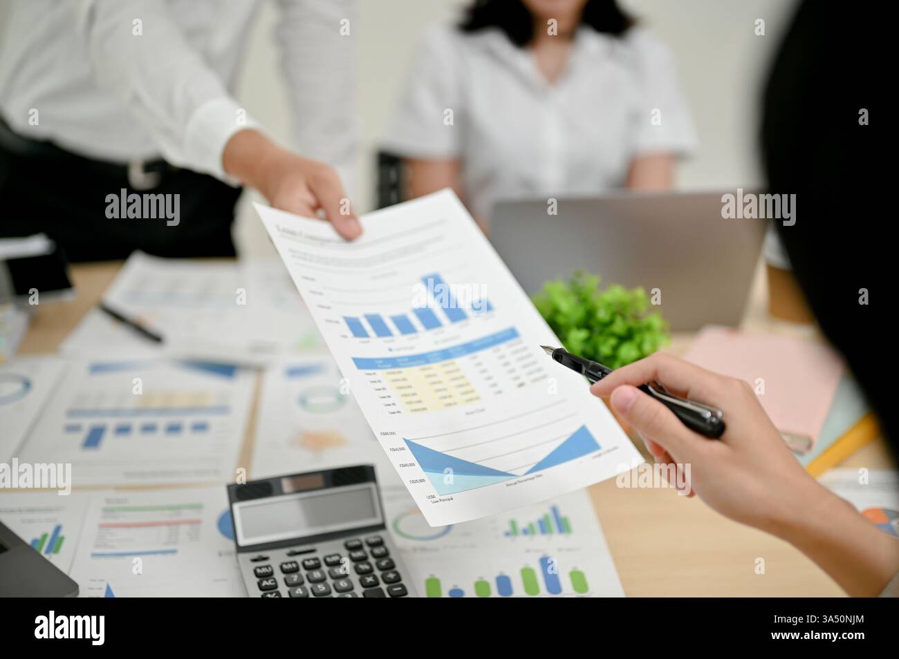 Businessman handing in a report hi-res stock photography and images - Alamy