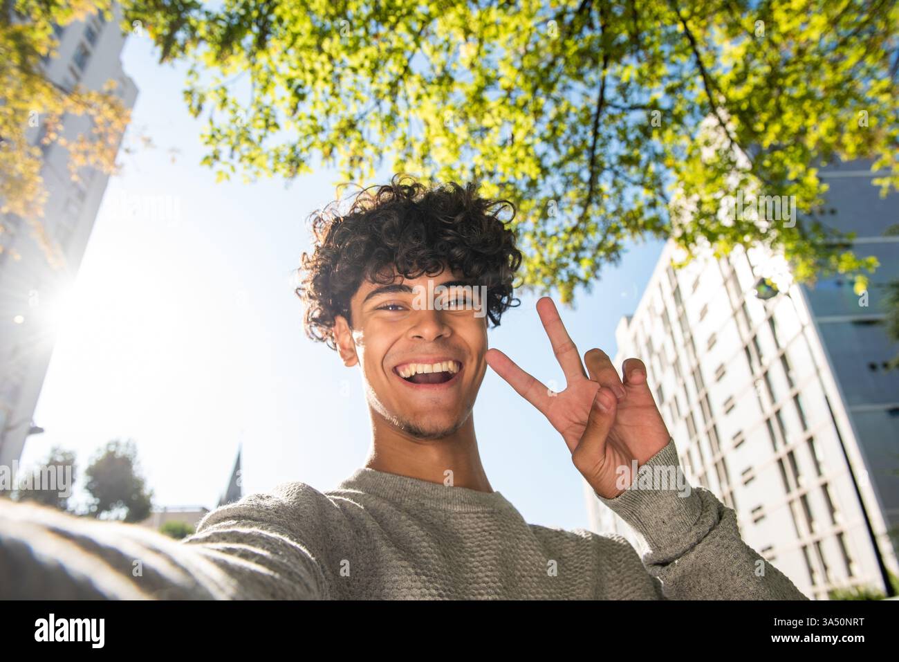 Portrait handsome young man taking selfie with hand peace sign Stock ...