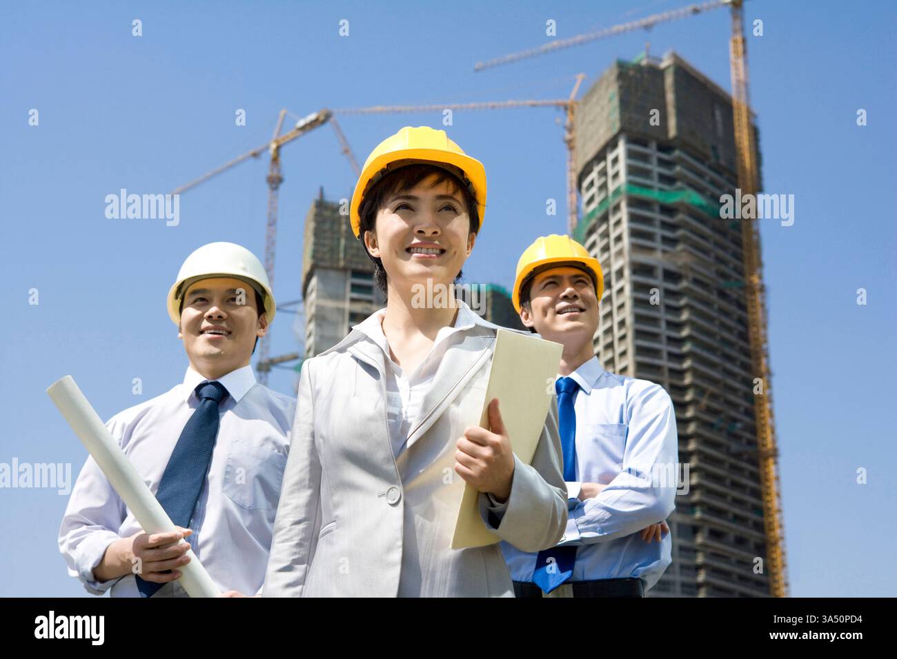Chinese engineers wearing safety hi-res stock photography and images ...