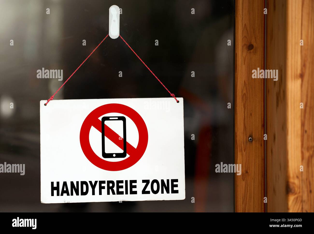 March 20, 2025: PHOTOMONTAGE, A sign with the inscription: Cell phone ...